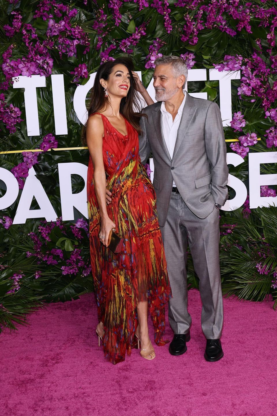 Amal and George Clooney at the LA premiere of Ticket To Paradise in Los ...